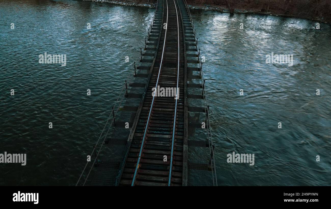 Railroad Tracks over Bridge at Dawn Stock Photo - Alamy