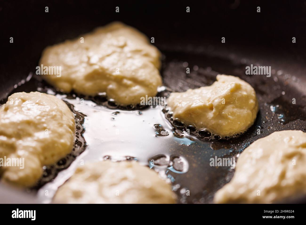 process of roasting traditional pancakes on skillet with sunflower seed ...