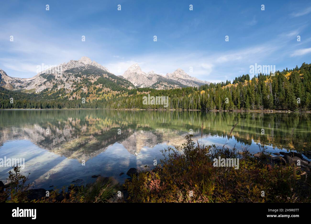 Reflection in Taggart Lake, view of the Teton Range, peaks Grand Teton ...