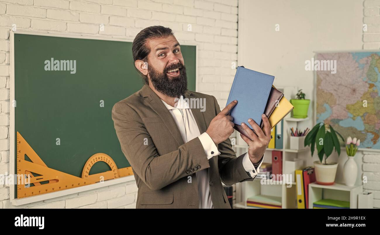 happy teacher with workbook and books ready for lesson, school Stock ...