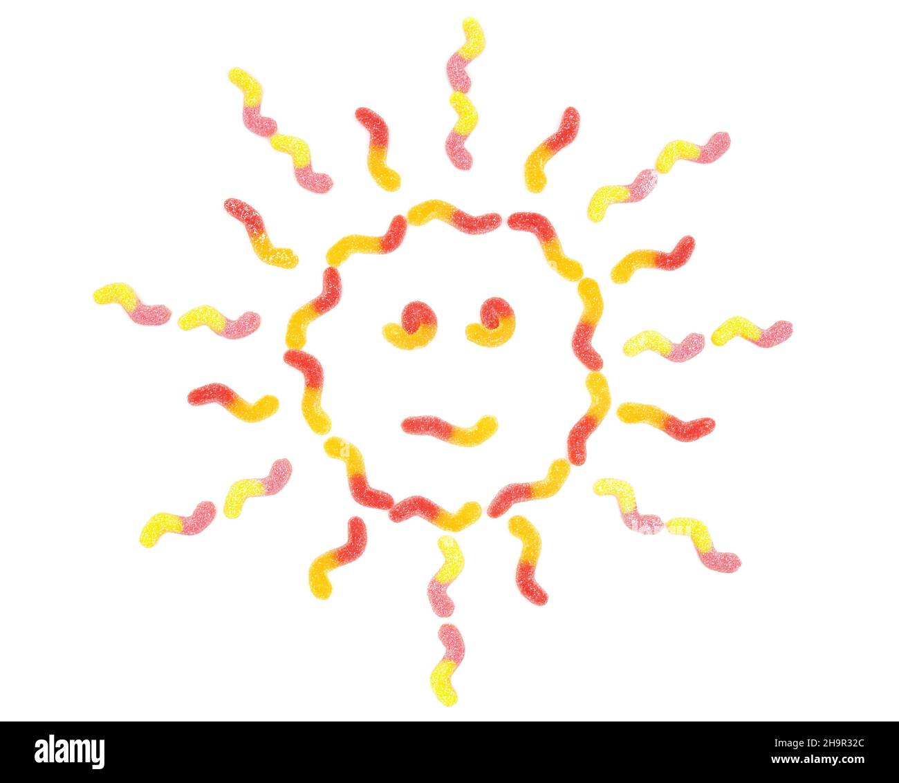 Sun shape made from gummy worm candies isolated on white background ...