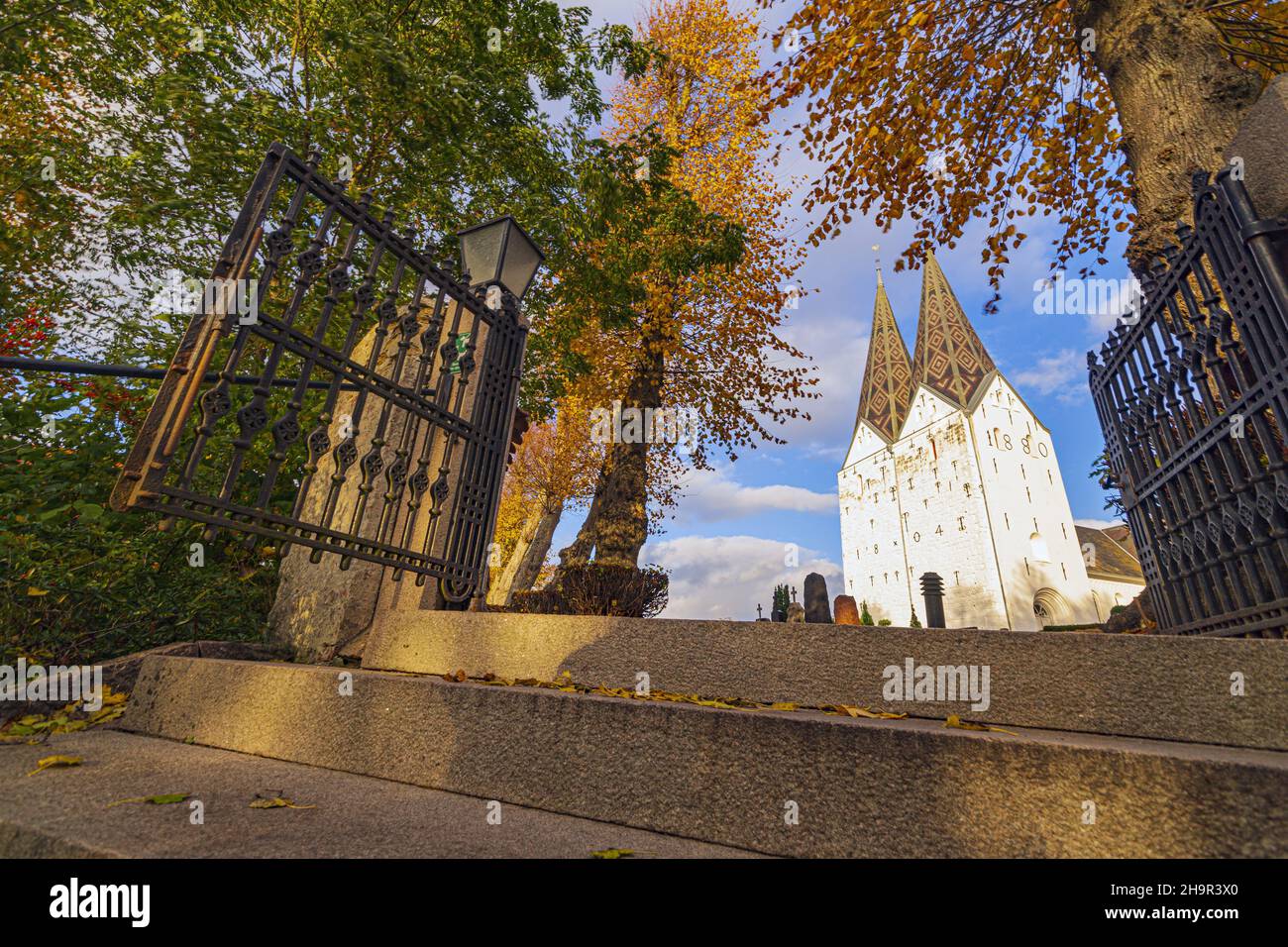 Low angle shot from the stairs of the yard of Broager Church in Denmark ...