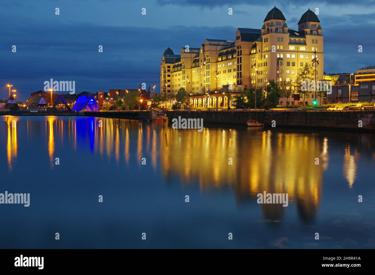 Large building reflected in the water, Havnelageret, Oslo, Norway Stock ...