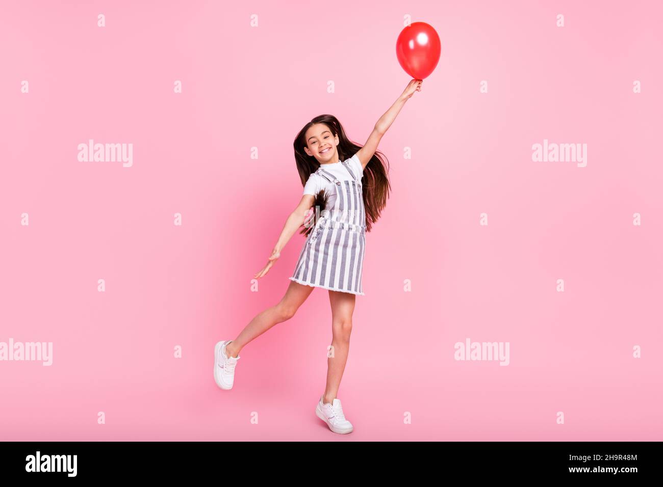 Full body photo of charming happy positive little girl hold hand catch ...