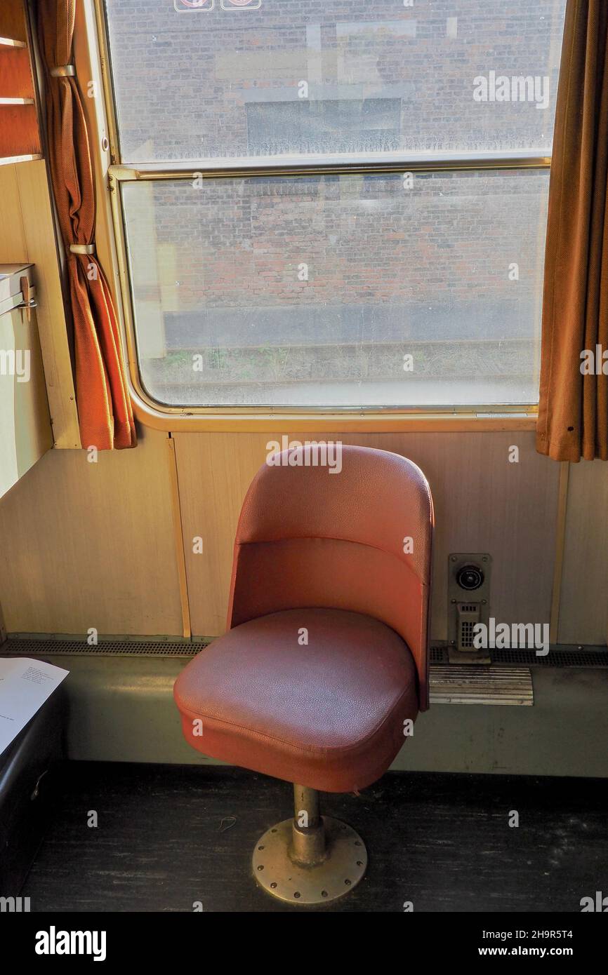 Red single seat inside an old train compartment, DB train compartment ...