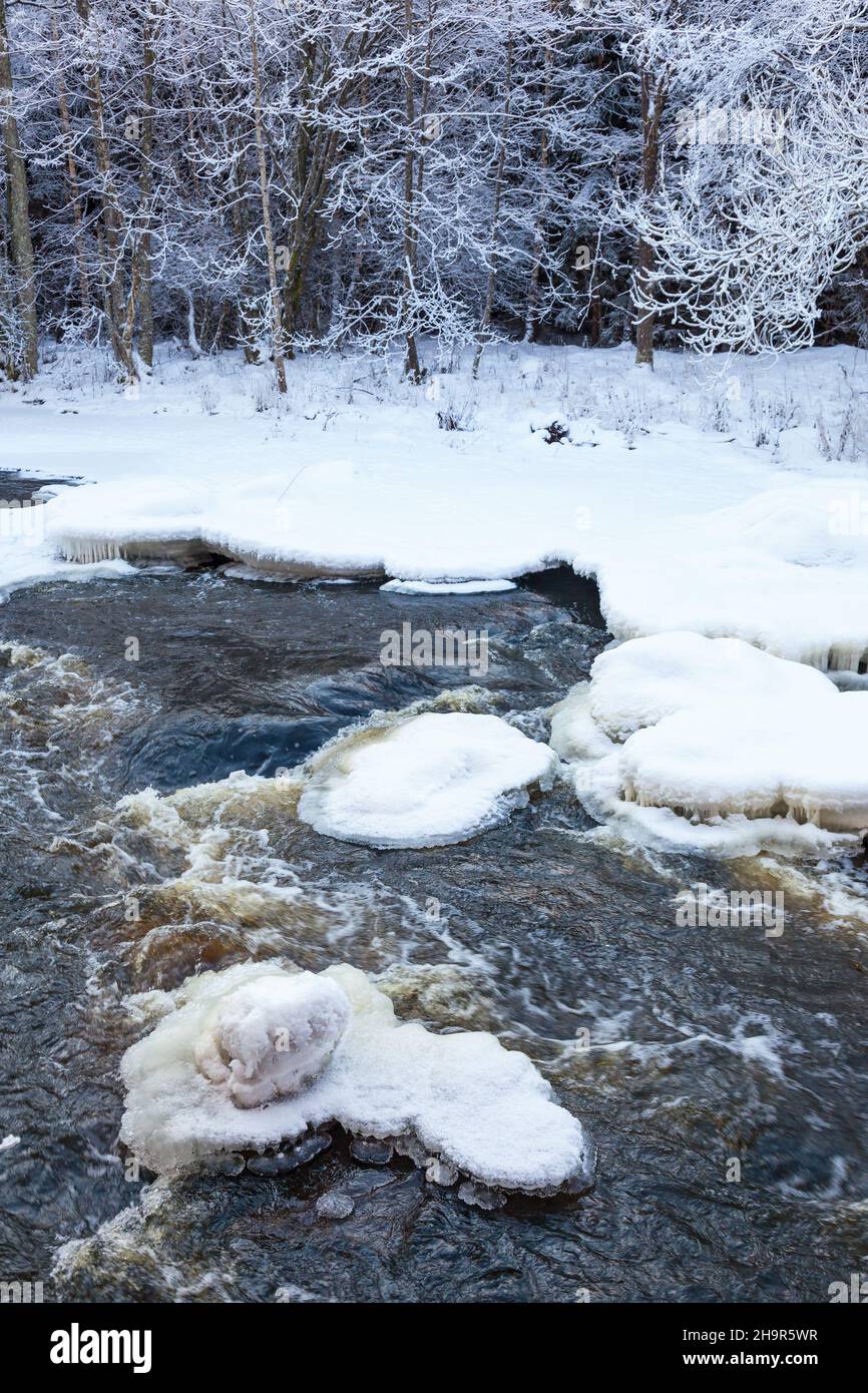 Running water in the river in winter Stock Photo - Alamy