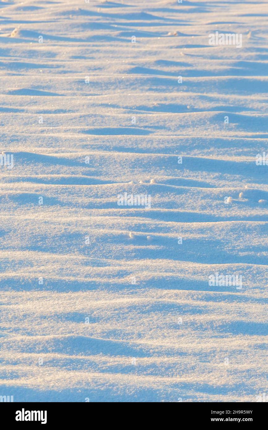 Wave pattern with snow on the field Stock Photo - Alamy