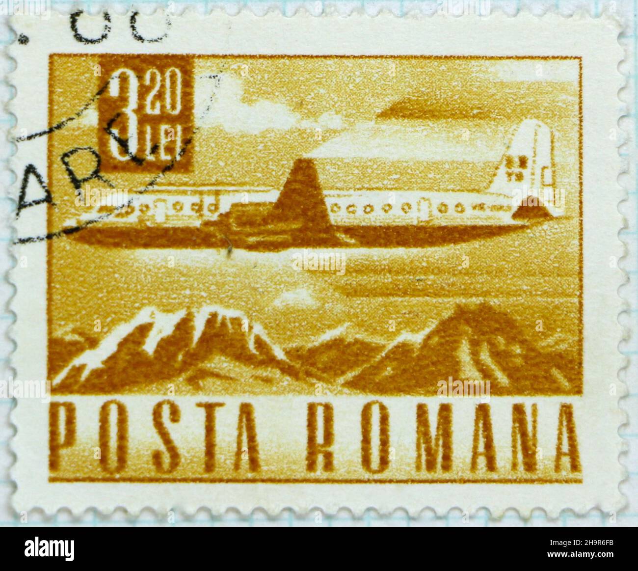 Photo of an orange brown postage stamp from Romania with a piston ...