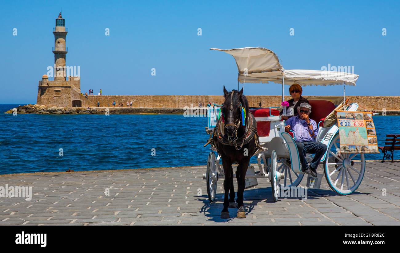 Panorama harbour town of Chania with tourist carriages, Crete, Chania ...