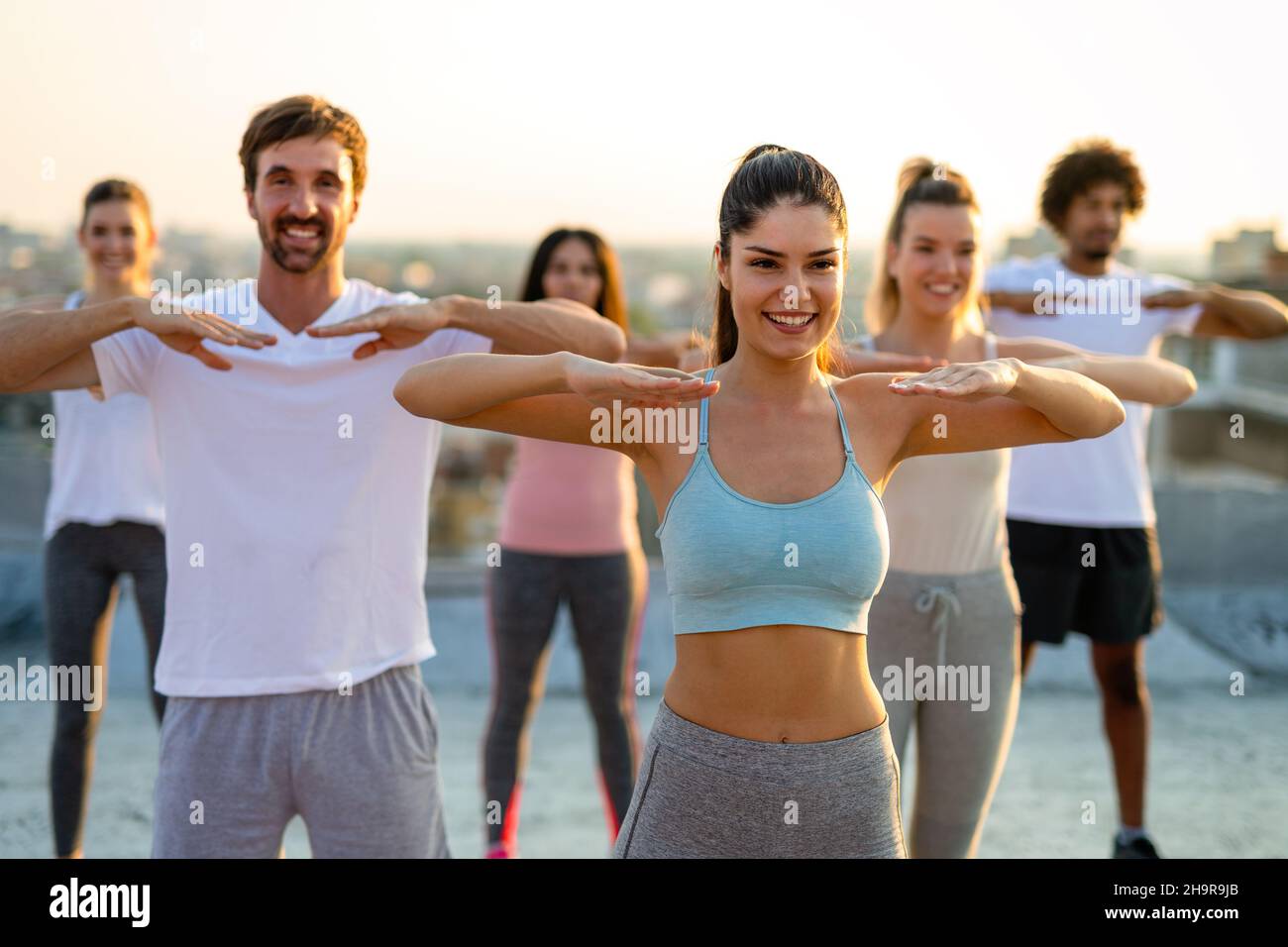Fitness sport friendship and healthy lifestyle concept. Group of happy ...
