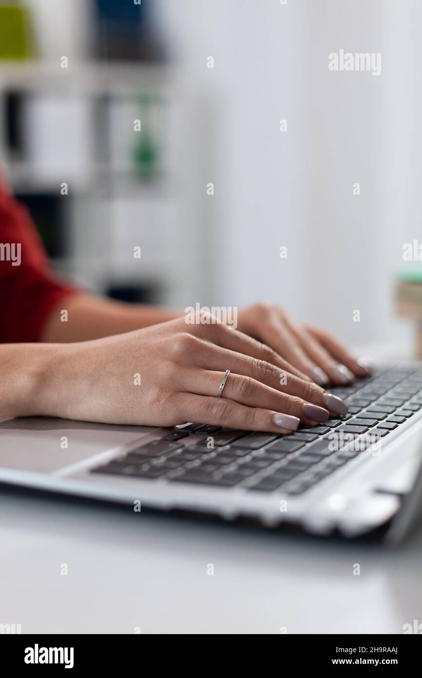 Closeup of startup manager hands typing on laptop. Detail of employee ...