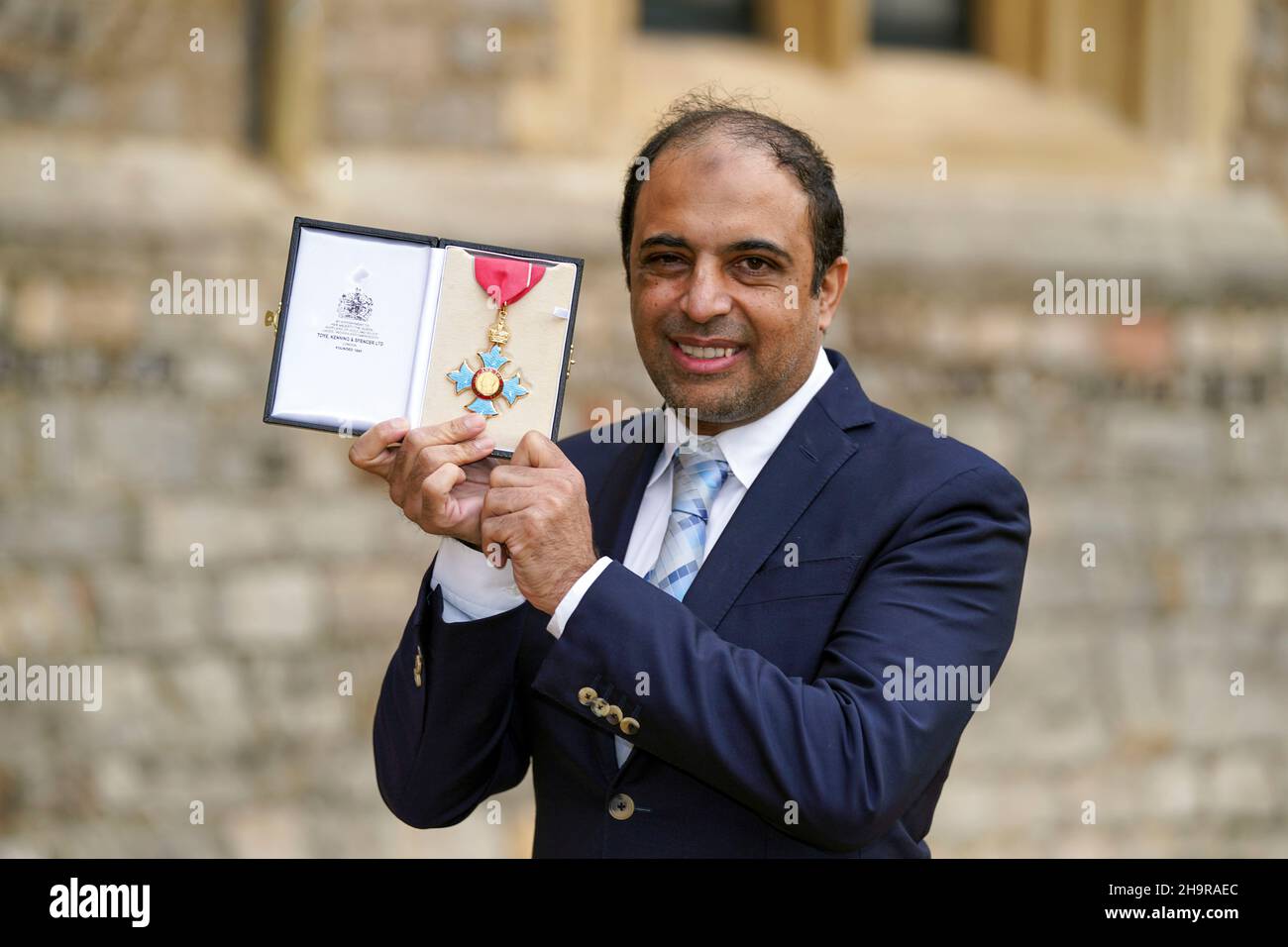 Mr. Zuber Issa from Blackburn with his award after he was made a CBE ...