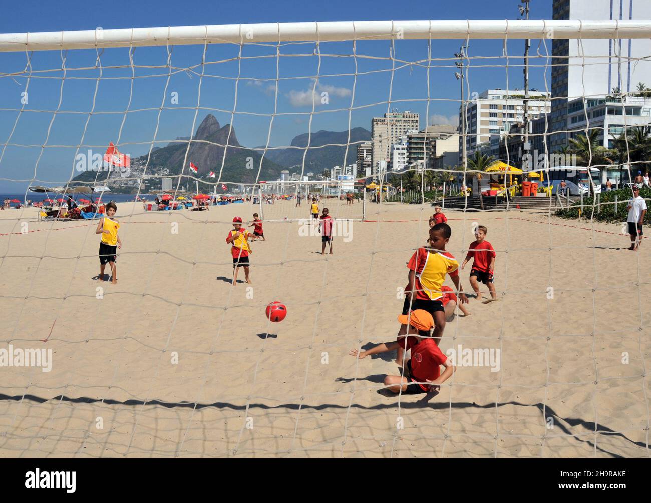 Brazilian children playing football on hi-res stock photography and ...