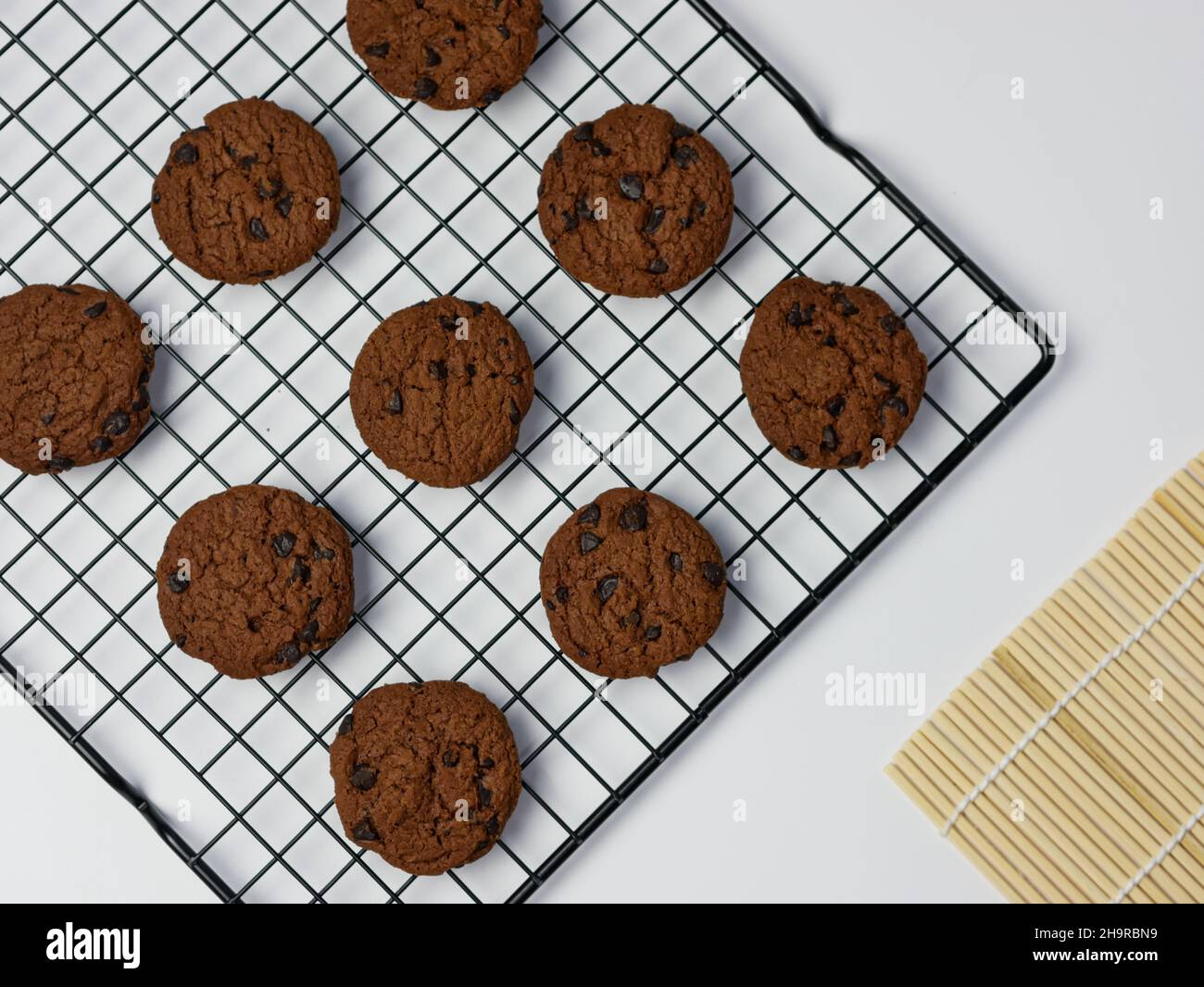 chocolate chip cookies on cooling rack with white background. Good ...