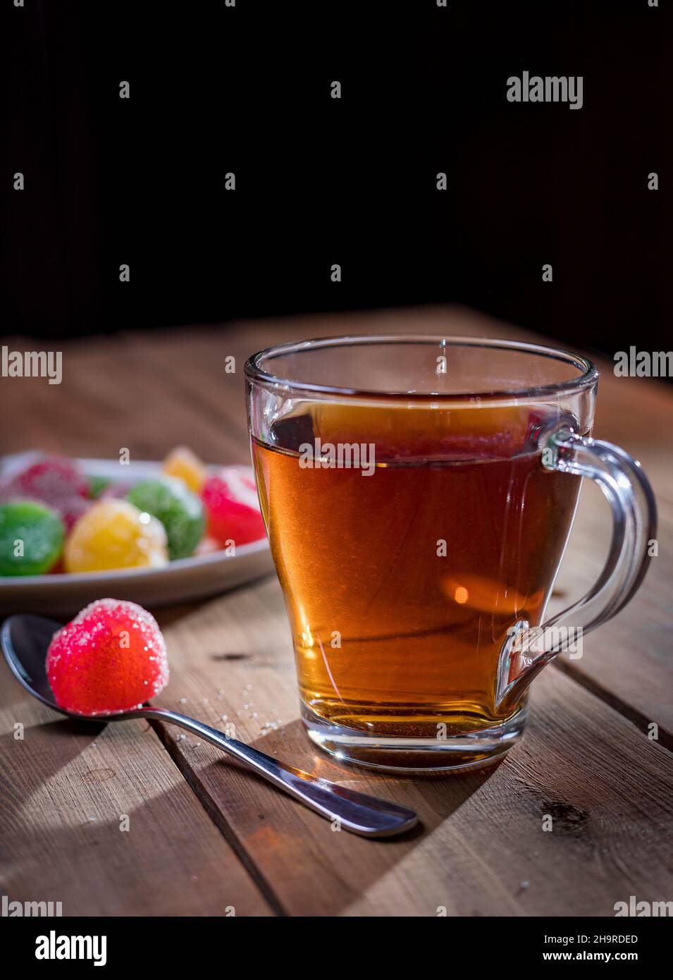 Glass cup of black tea with marmalade on a wooden background Stock ...