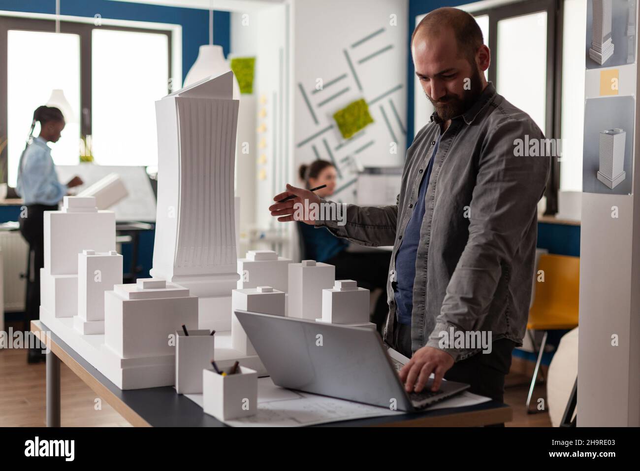 Arhitectural designer in videocall conference presenting white foam ...