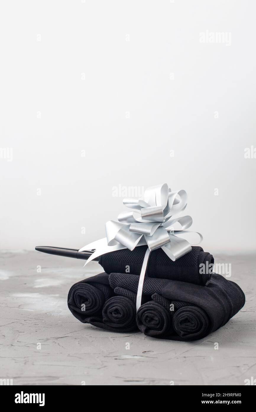 Handmade tanks of socks as gift to men on February 23 on grey ...