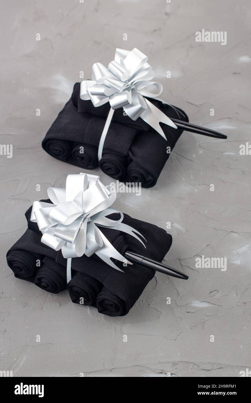 Handmade tanks of socks as gift to men on February 23 on white ...