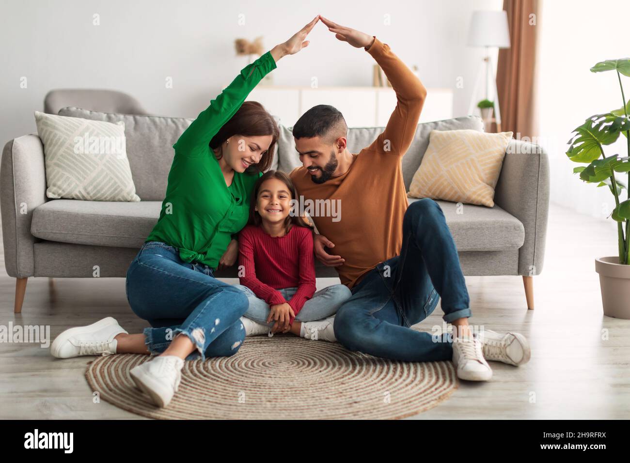 Arab parents making symbolic roof of hands above their daughter Stock ...