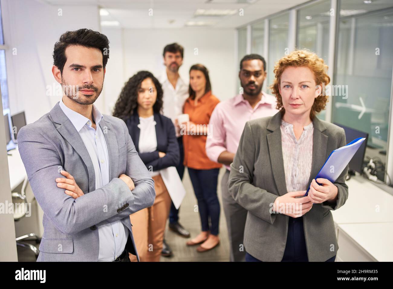 Self-confident business start-up team with founders and trainees in the ...