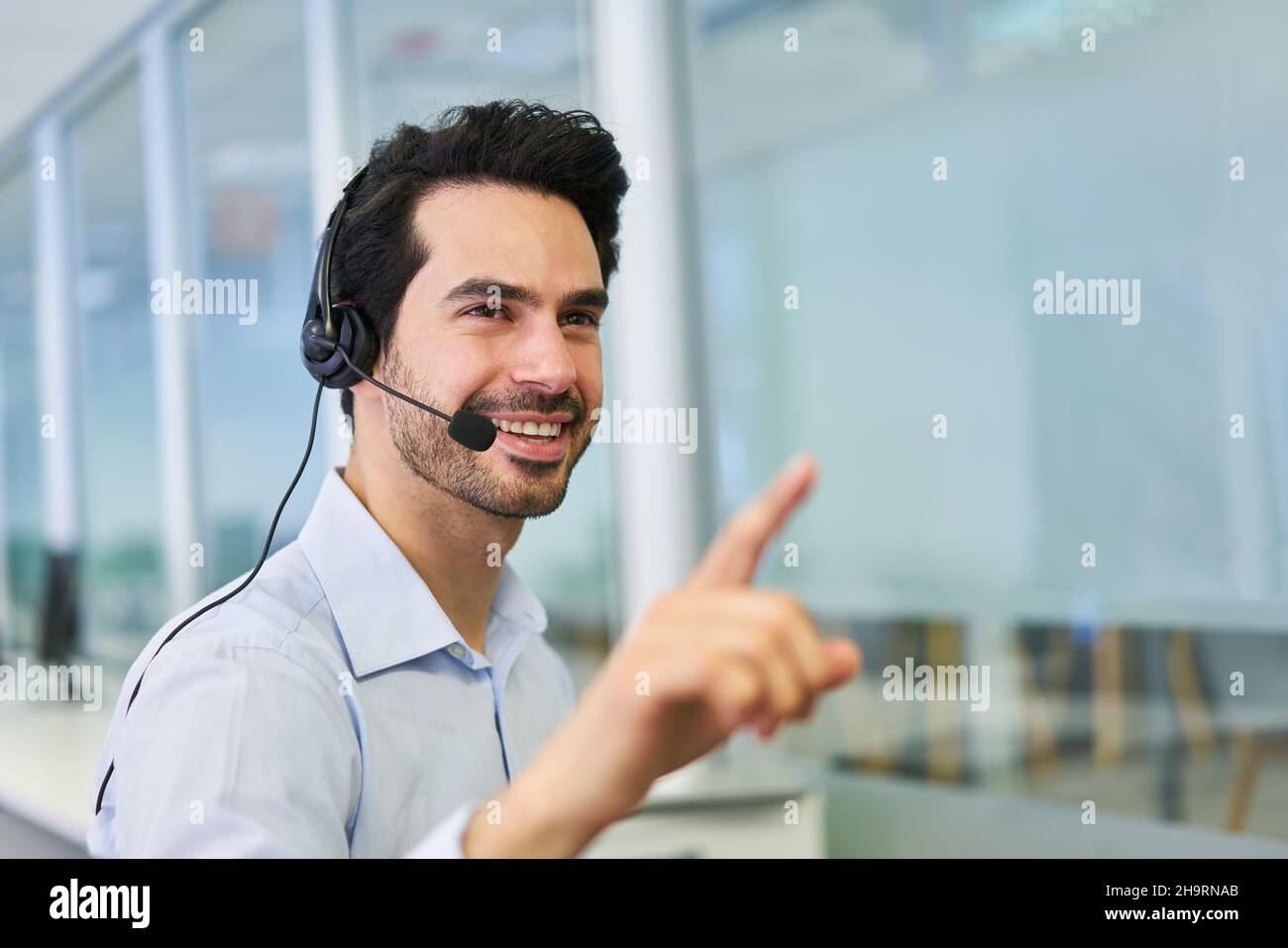Business man with headset as a consultant or customer service ...