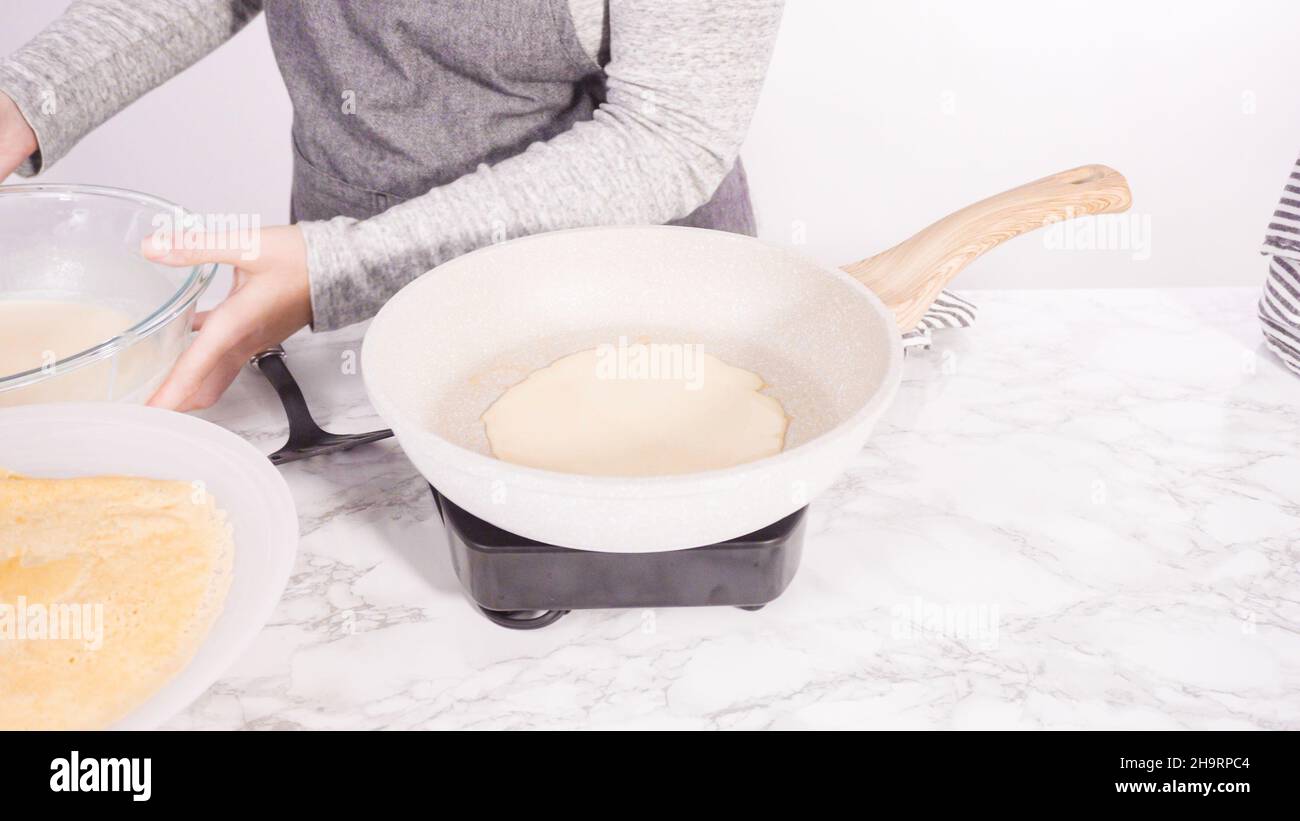 Making crepes in a small frying pan over medium heat Stock Photo - Alamy