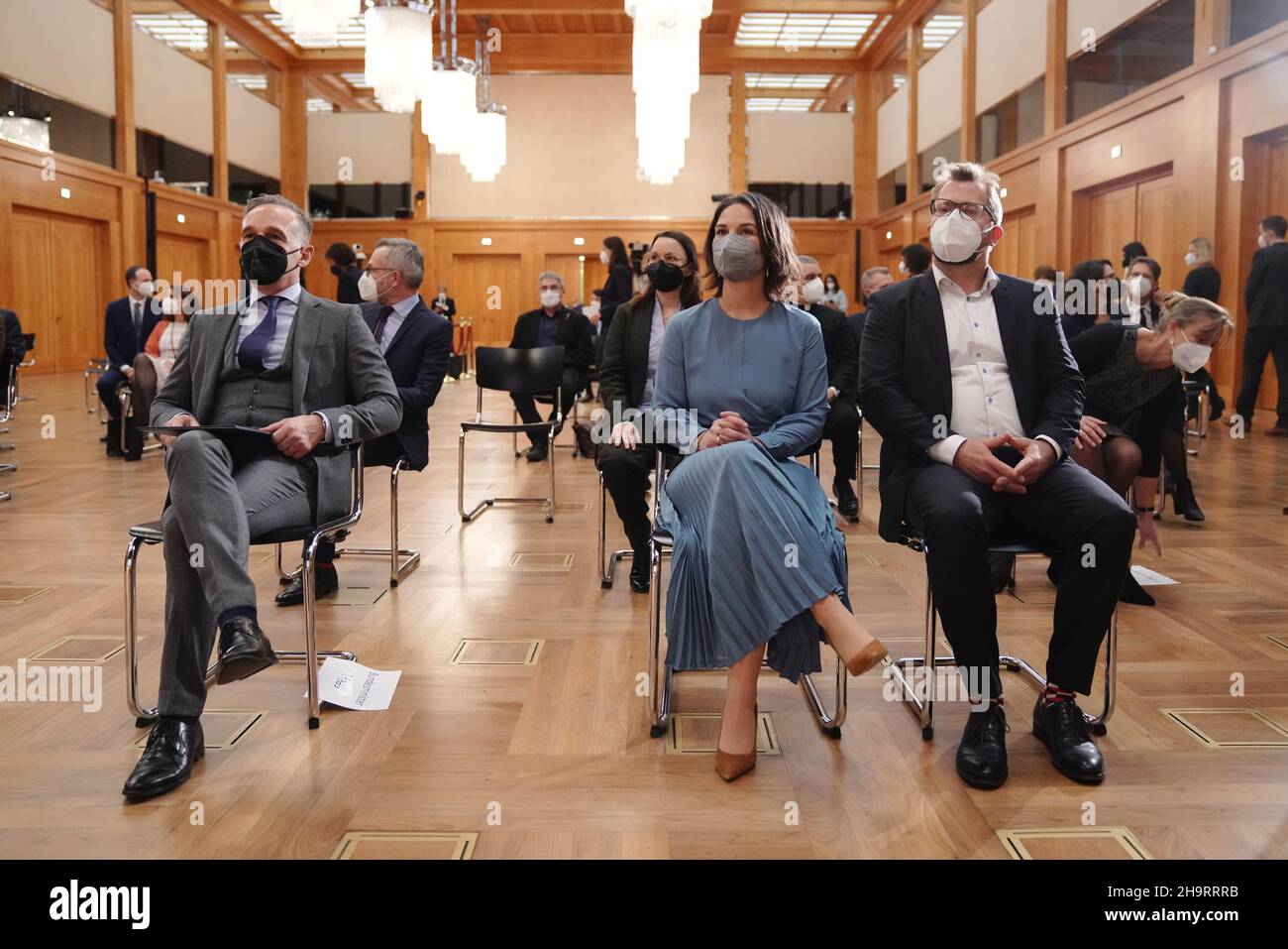 Berlin, Germany. 08th Dec, 2021. Annalena Baerbock sits next to her ...