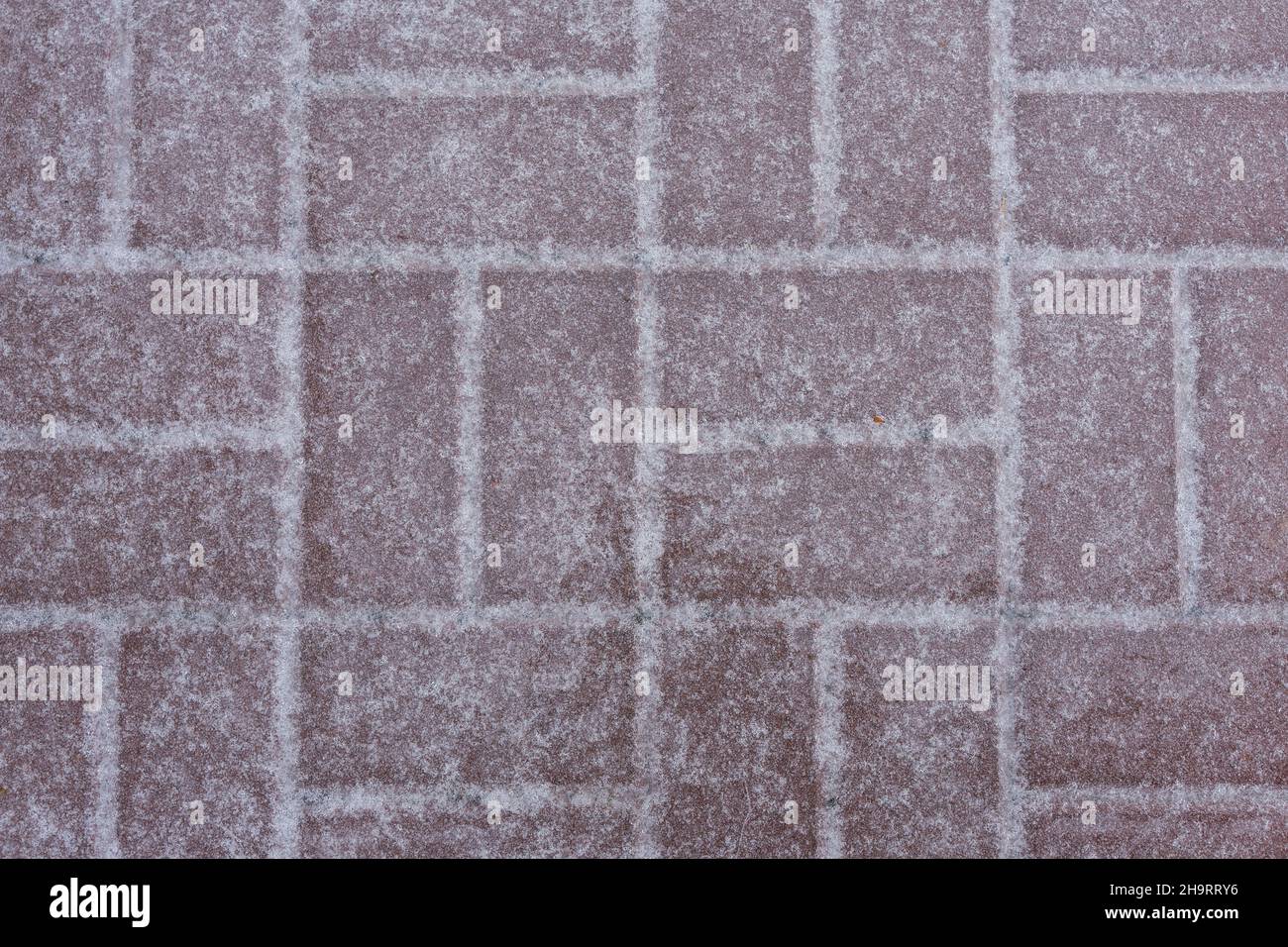 Ice on the pavement (sidewalk). Dangerous weather for the movement of ...