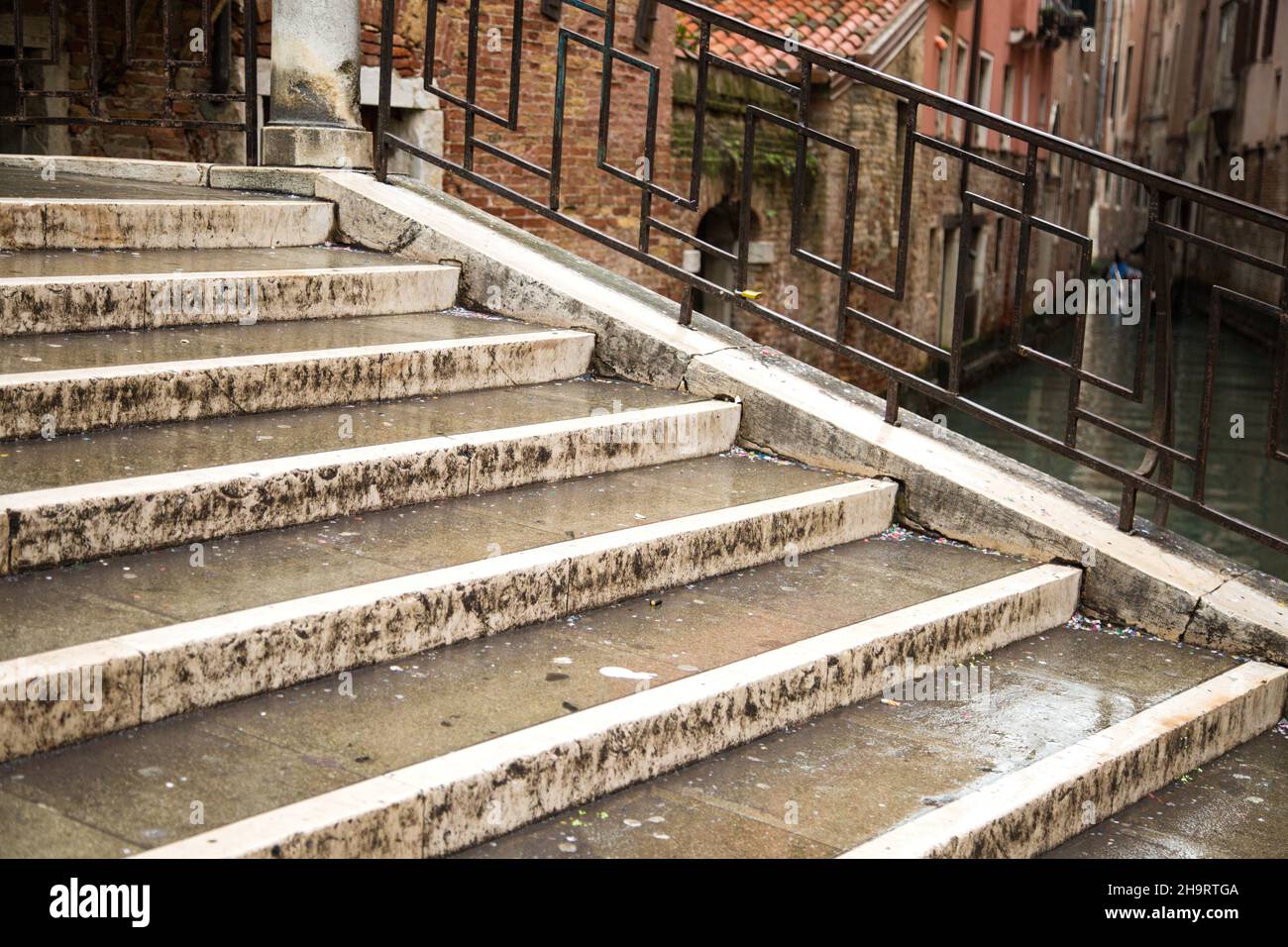 Empty stairs of a marble ladder with metal railings in Venezia. Rainy ...