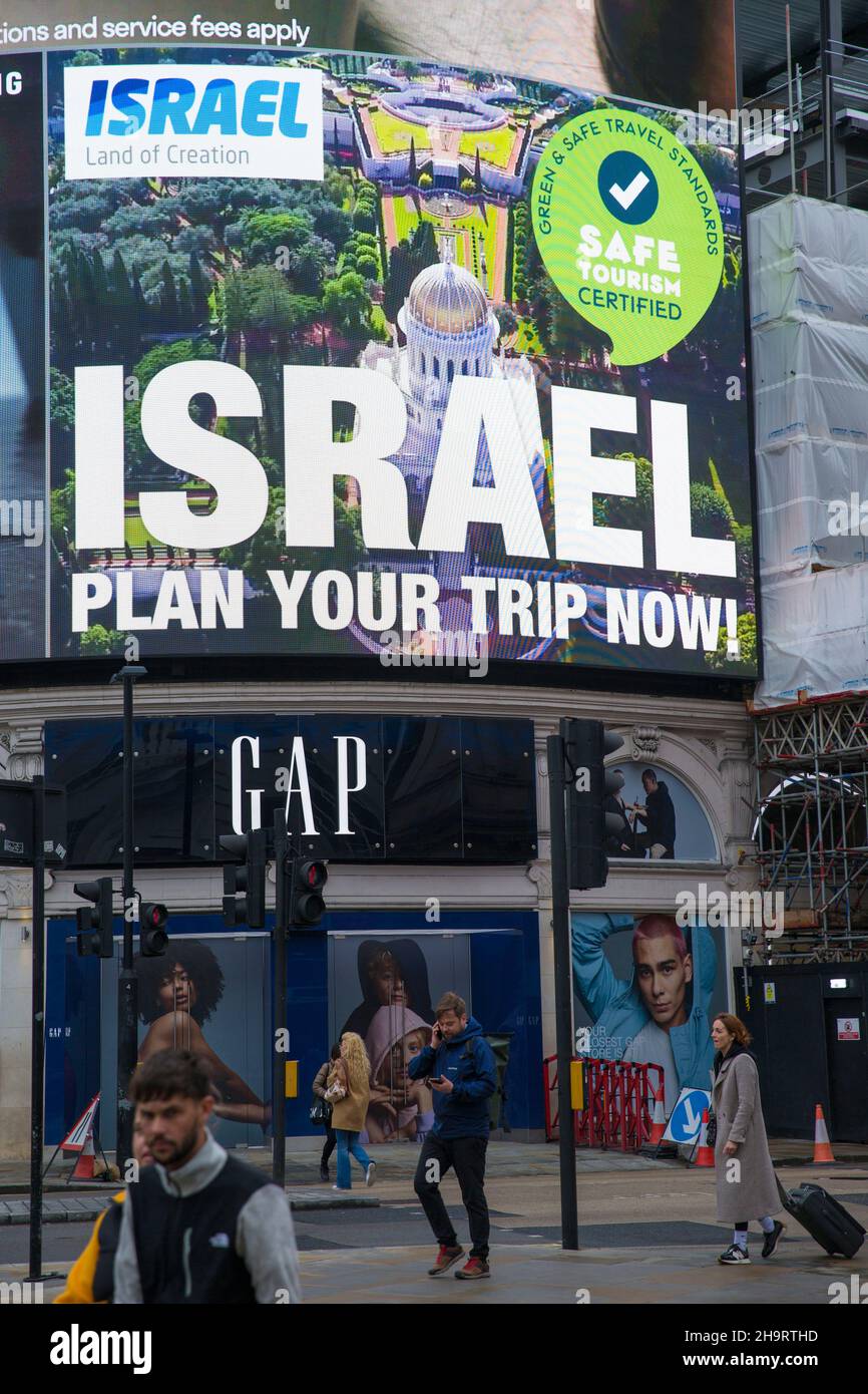 Pedestrians walk past an advertisement for Israeli tourism displayed on ...