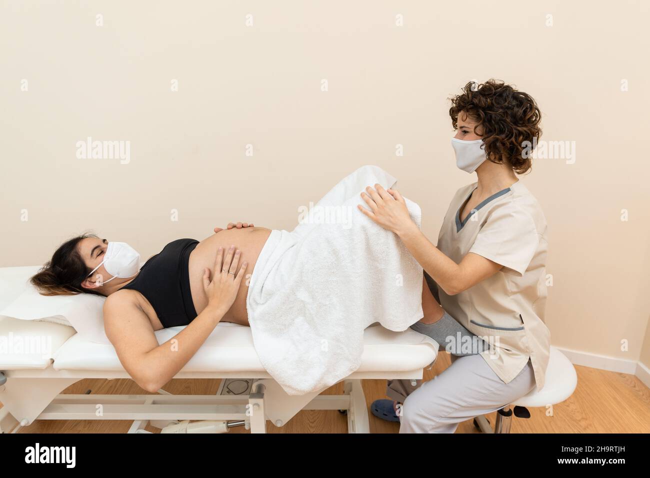 Gynecologist examining and performing pelvic floor treatment on ...