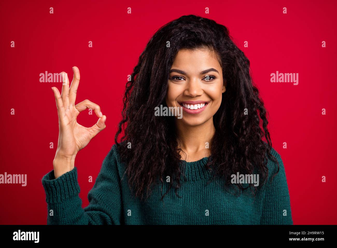 Photo of lucky adorable dark skin woman dressed green pullover smiling ...
