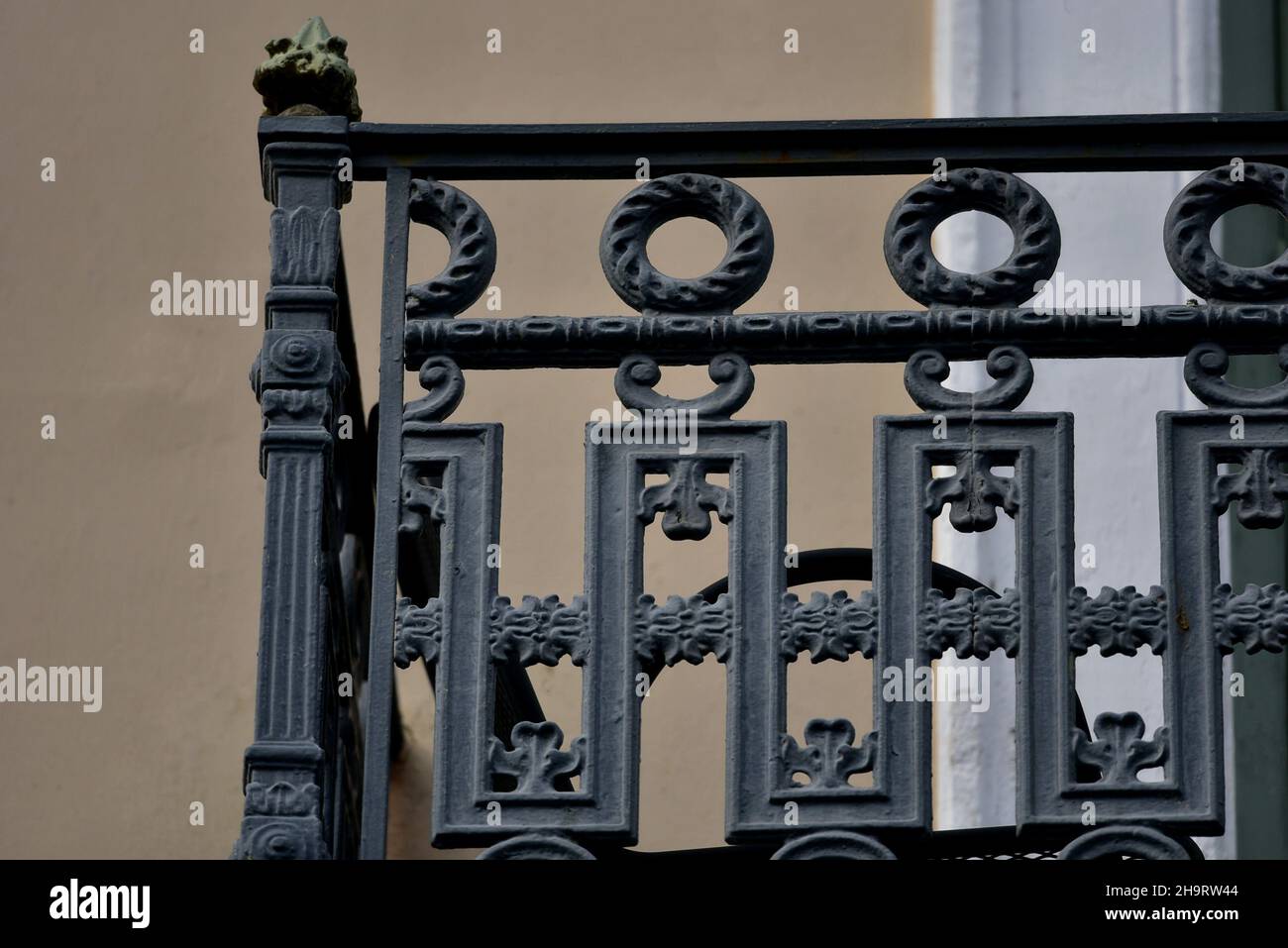 Old Neoclassical house handcrafted wrought iron balcony railing against ...