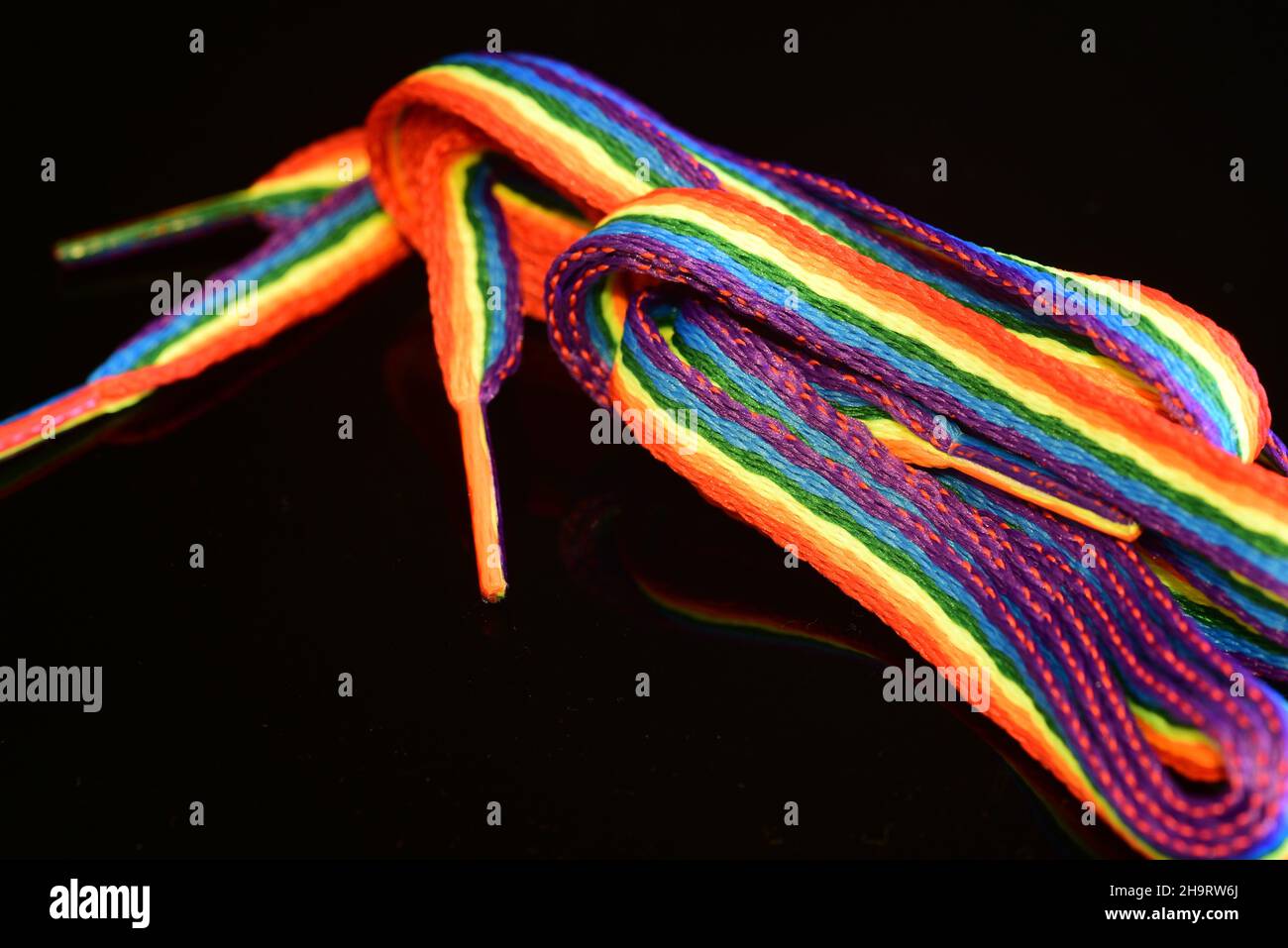Rainbow Laces on black background Stock Photo - Alamy