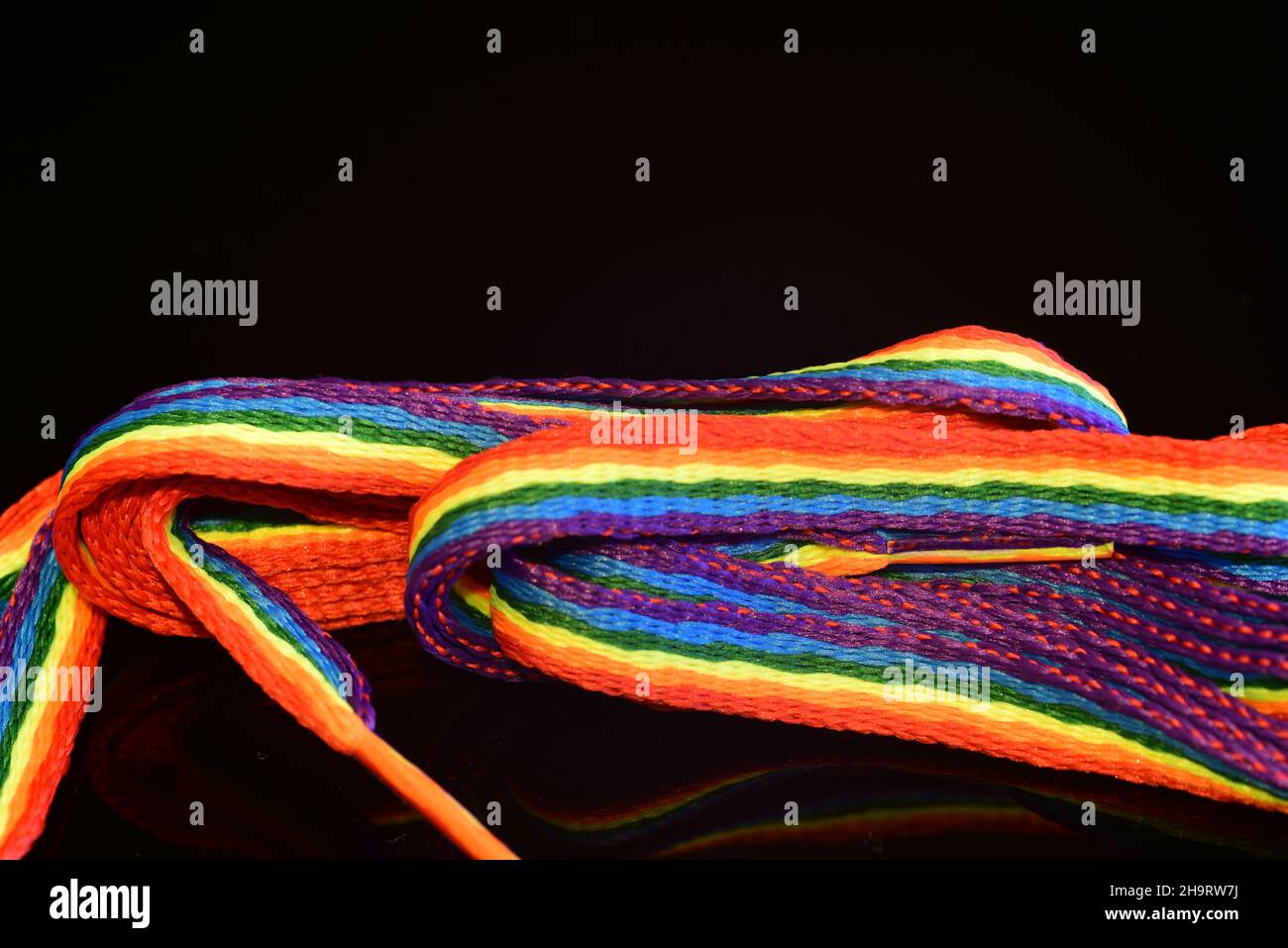 Rainbow Laces on black background Stock Photo - Alamy