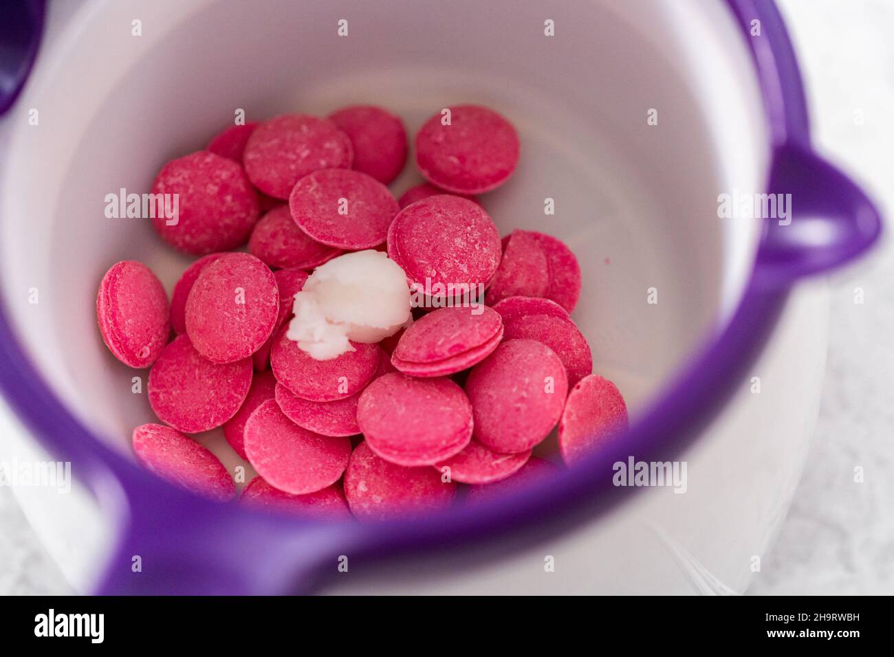 Melting chocolate melts in a candy melting pot to prepare gourmet mini ...