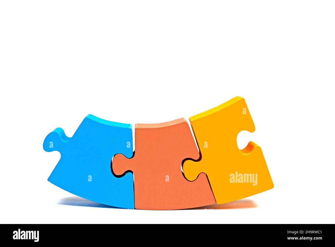 Three puzzle pieces joined together against a white background Stock ...