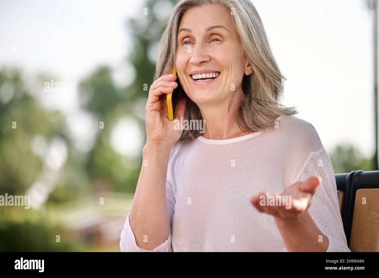 Ear talking hi-res stock photography and images - Alamy