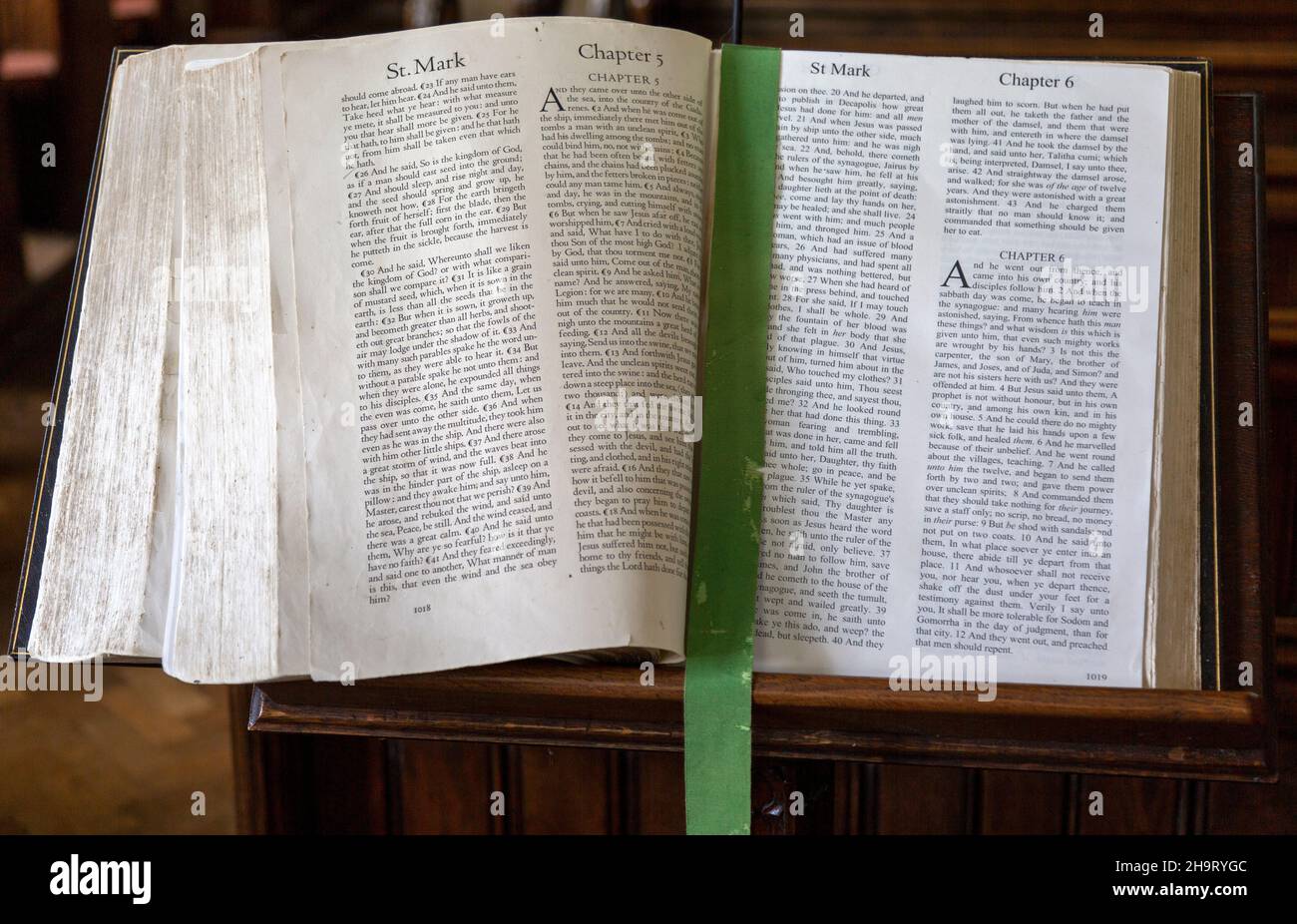 Historic old bible open at Chapter five and six of gospel of Saint Mark ...