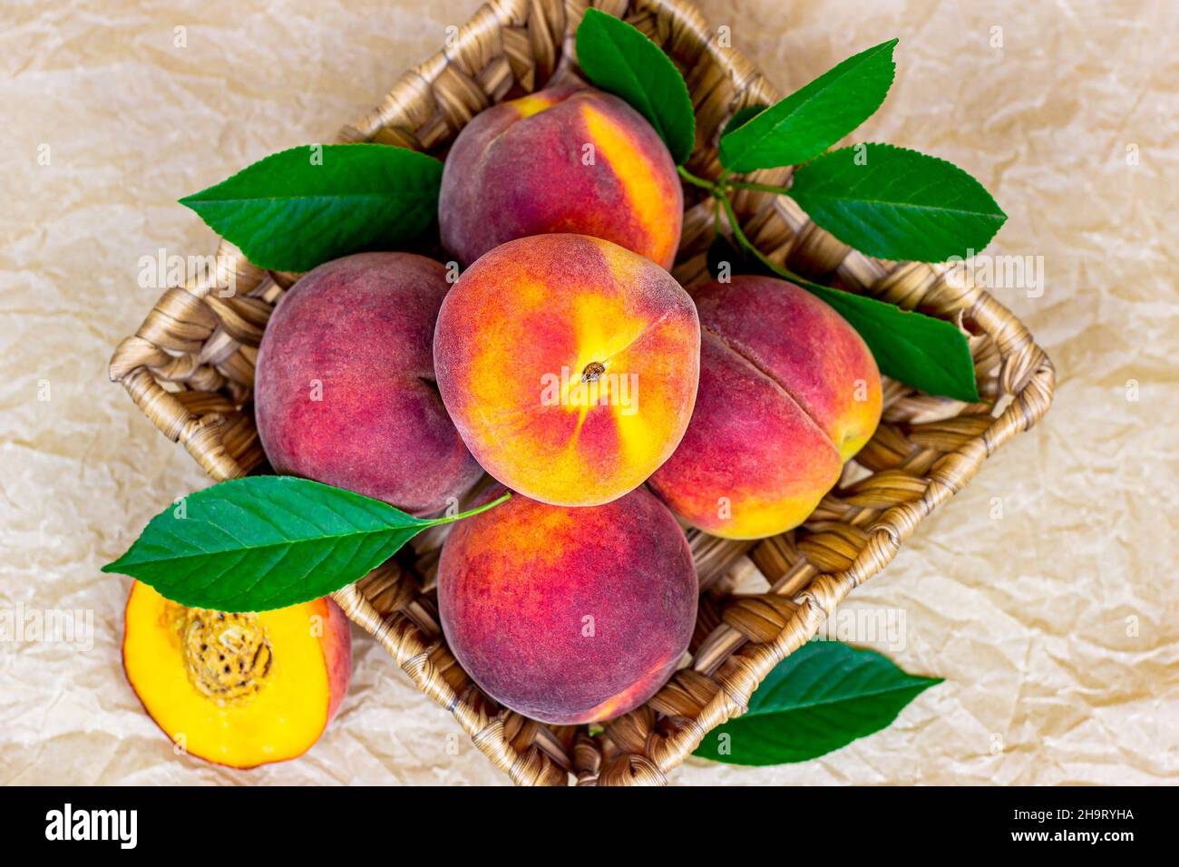 Top view of fresh juicy red, yellow and orange peaches in the wooden ...