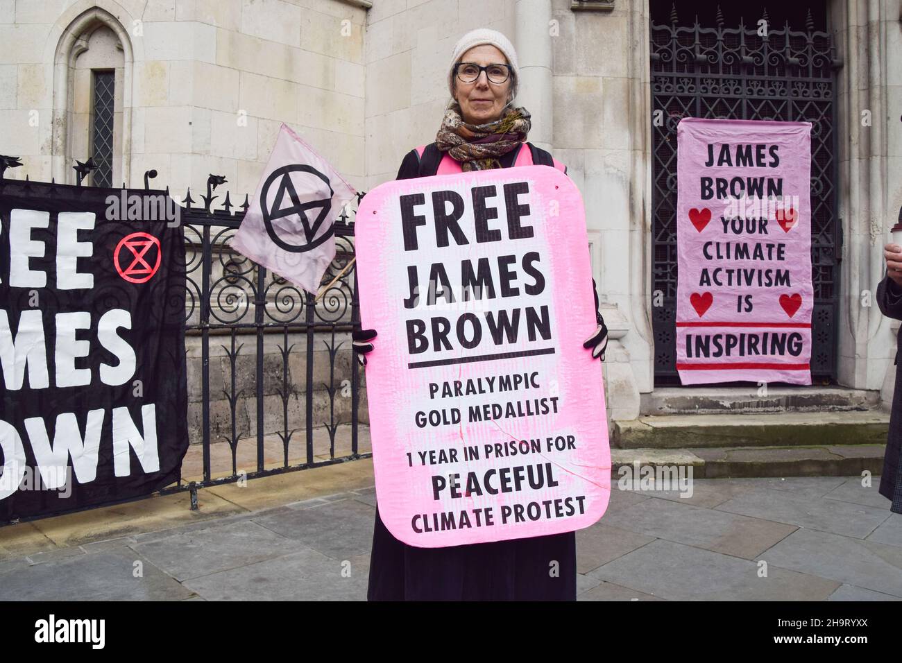 London, UK. 08th Dec, 2021. A protester holds a 'Free James Brown ...