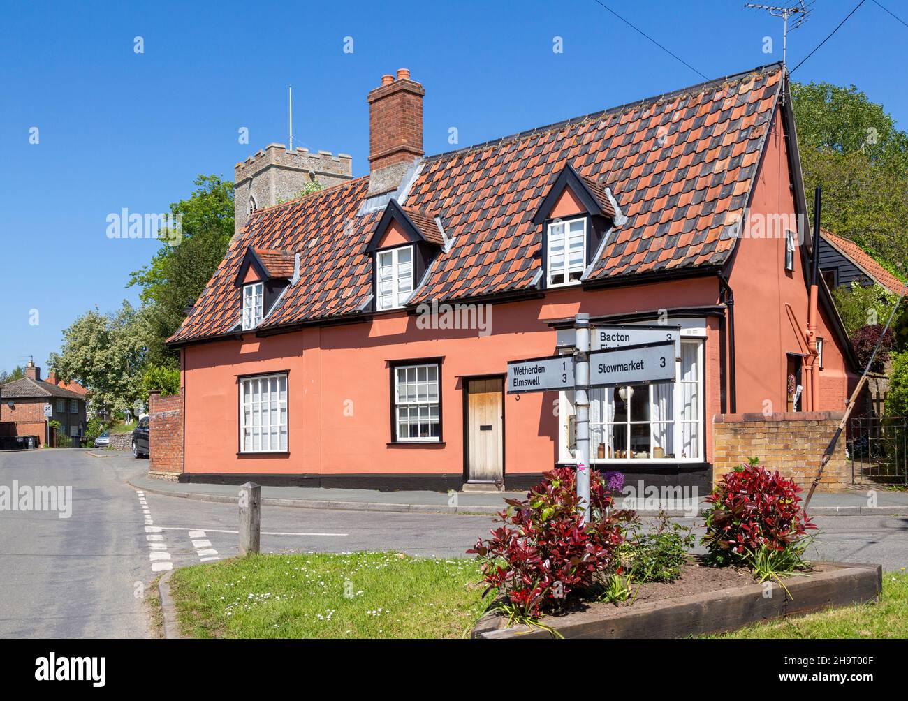 Road sign at village road junction distances to nearby places, Haughley ...