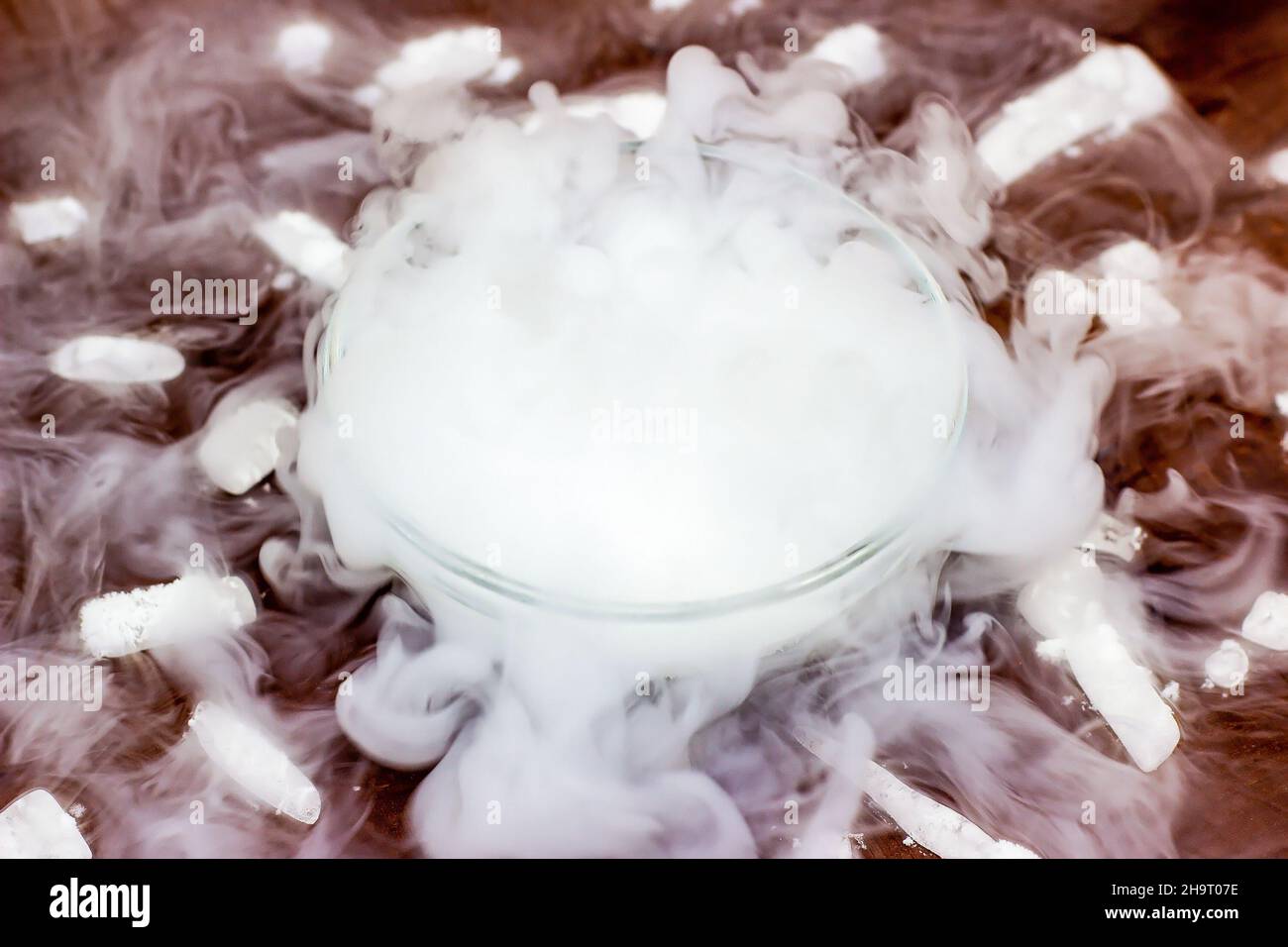 White cool dry ice (frozen carbon dioxide) with smoke effect in the ...