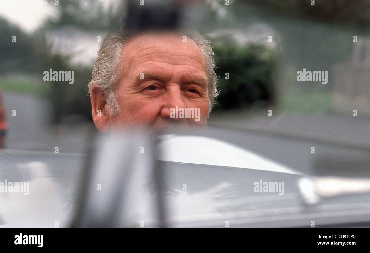 Jaguar Test driver Norman Dewis at the wheel of a 1954 Jaguar XK120 ...