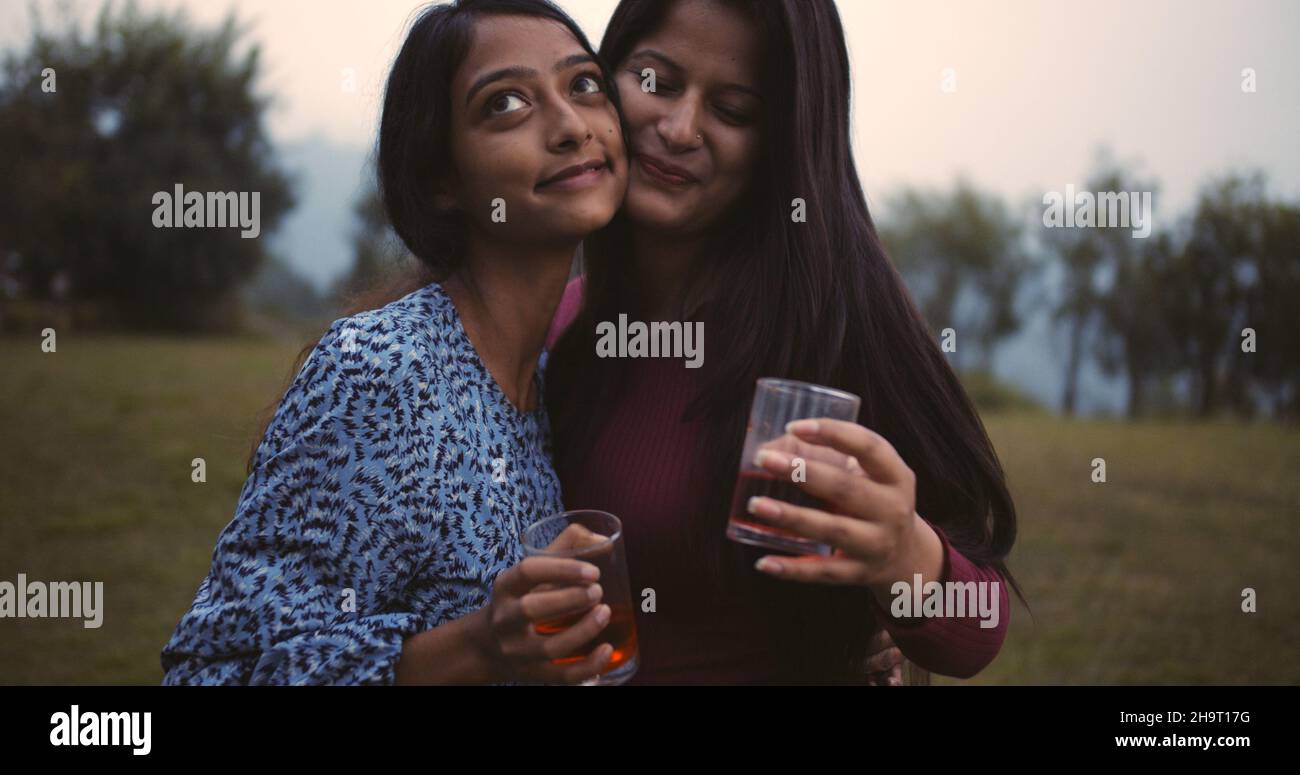 Two friends sharing hug hi-res stock photography and images - Alamy