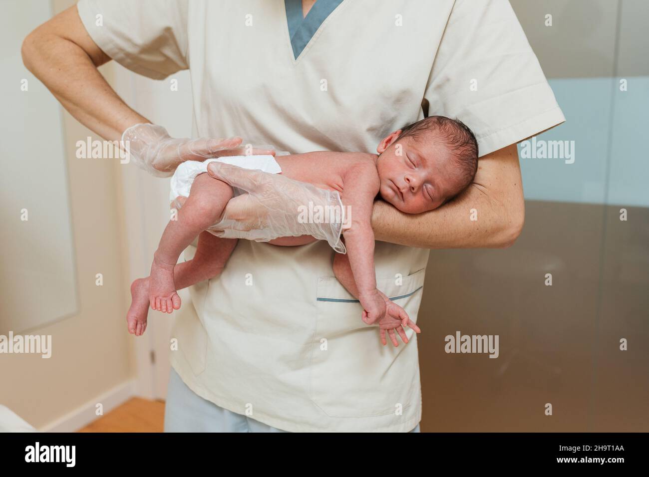 Professional physiotherapist working with a newborn baby Stock Photo ...