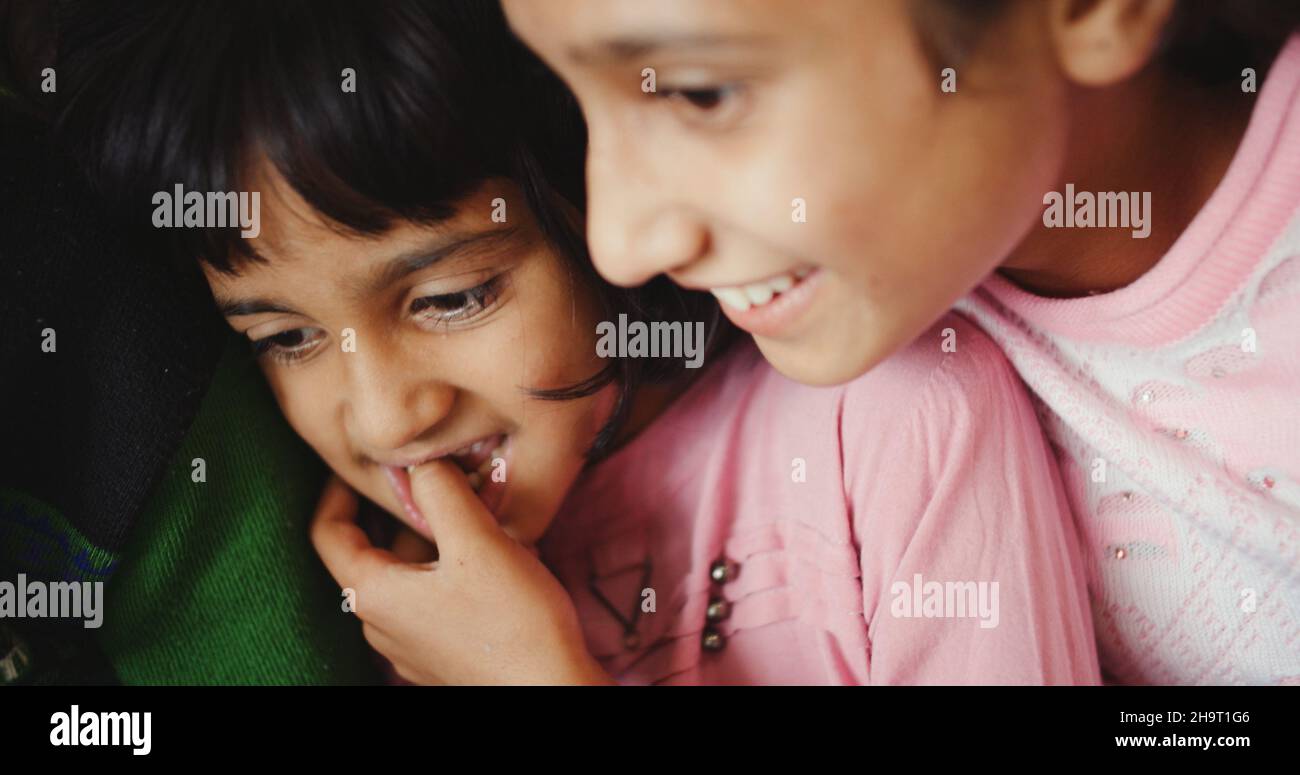 Shallow focus of two loving siblings happily cuddling together Stock ...