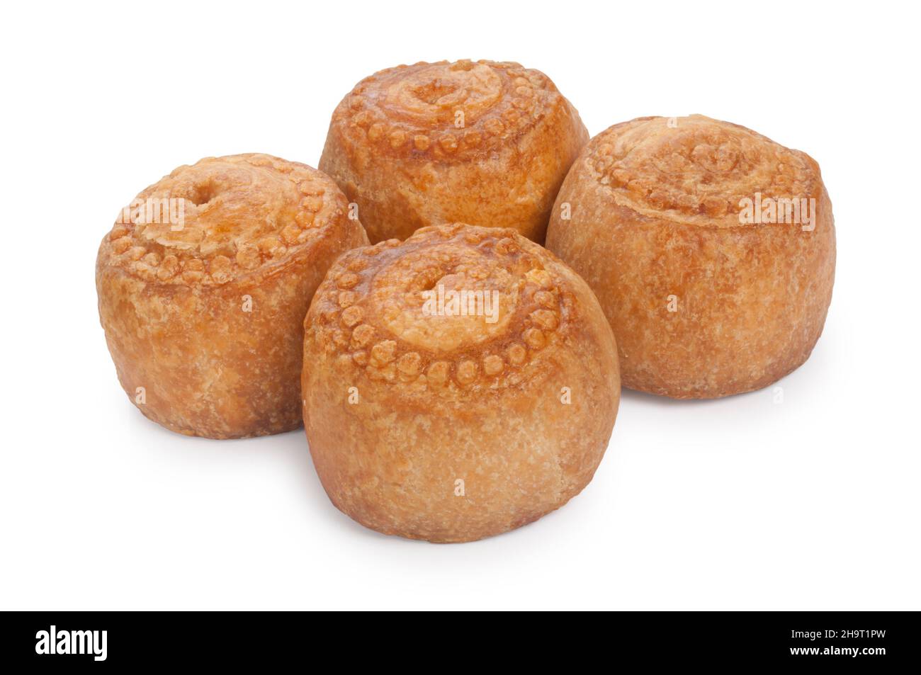 studio shot of small pork pies cut out against a white background ...