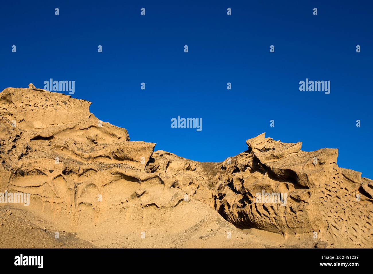 View at Vlychada beach volcanic ash sand rock formation on Santorini ...