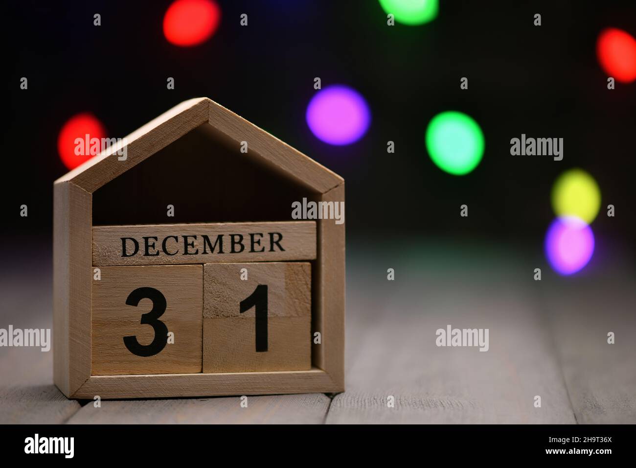 Christmas decorations on a wooden background: wooden cubes with the ...